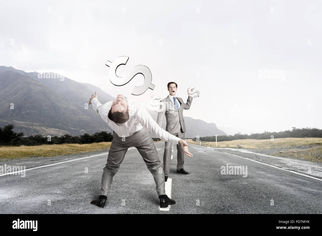 Young businessman benting to evade from thrown dollar sign Stock Photo ...