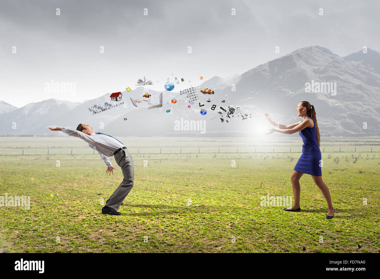 Young businessman trying to evade from thrown icons Stock Photo - Alamy