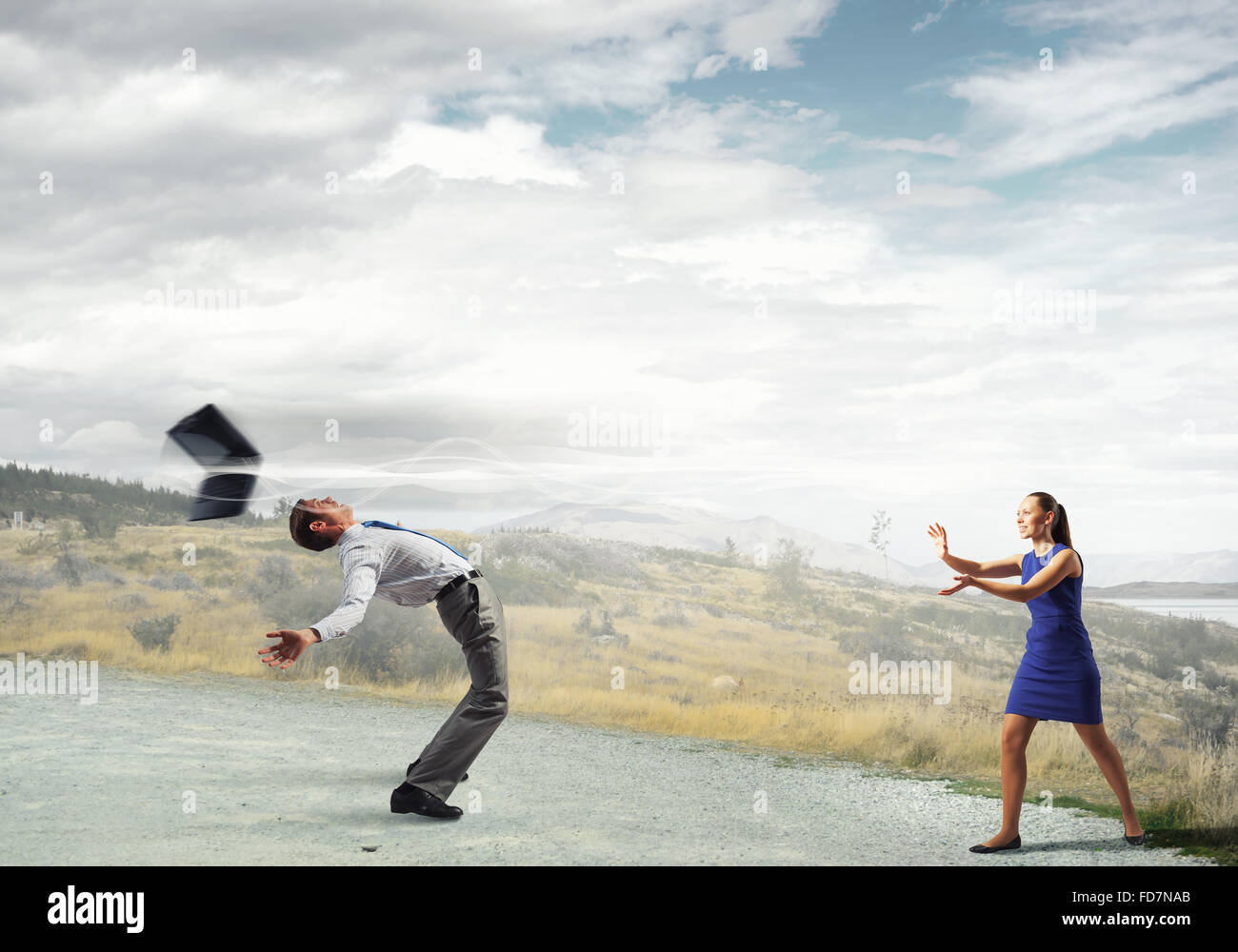 Young businessman trying to evade from thrown laptop Stock Photo - Alamy