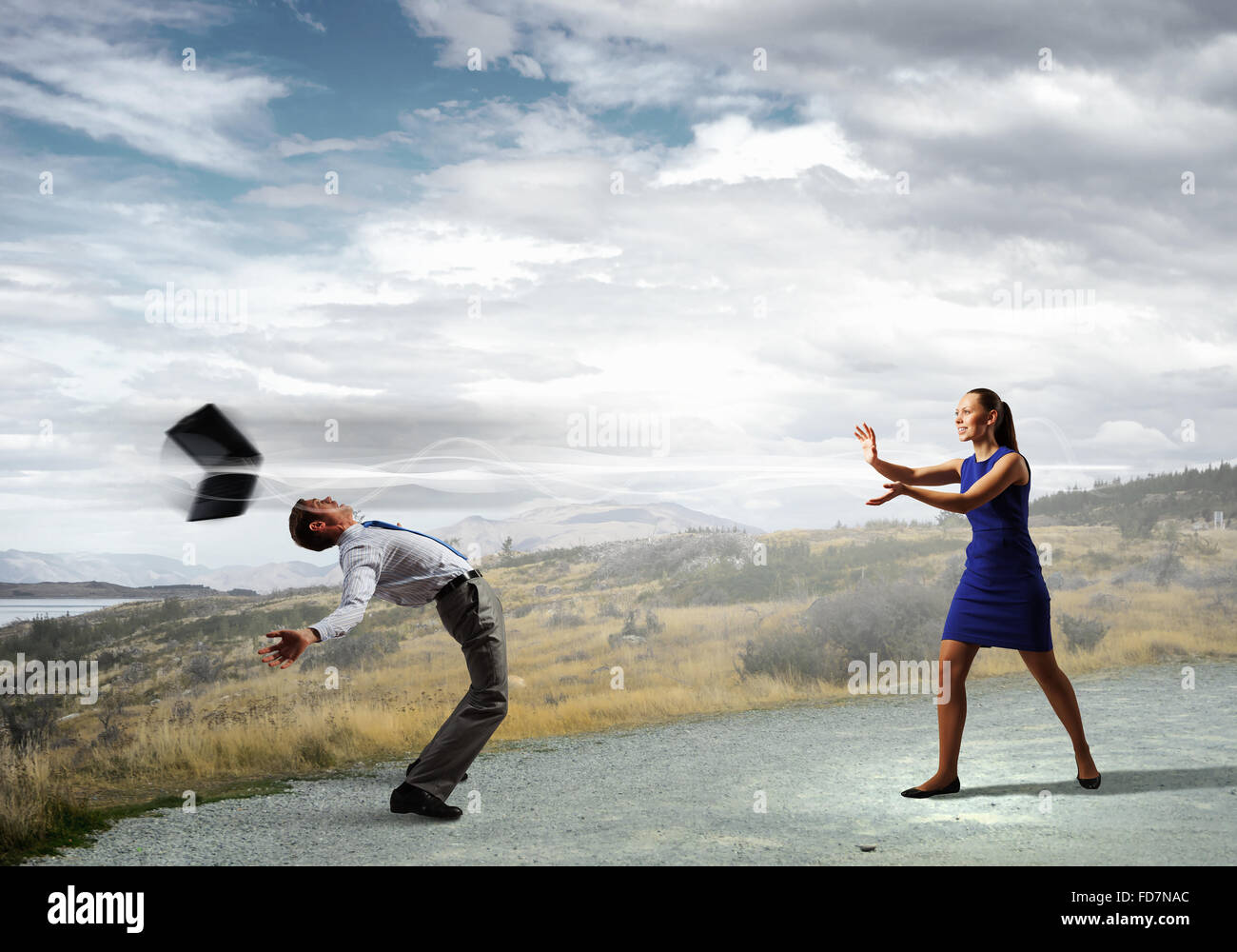 Young businessman trying to evade from thrown laptop Stock Photo - Alamy