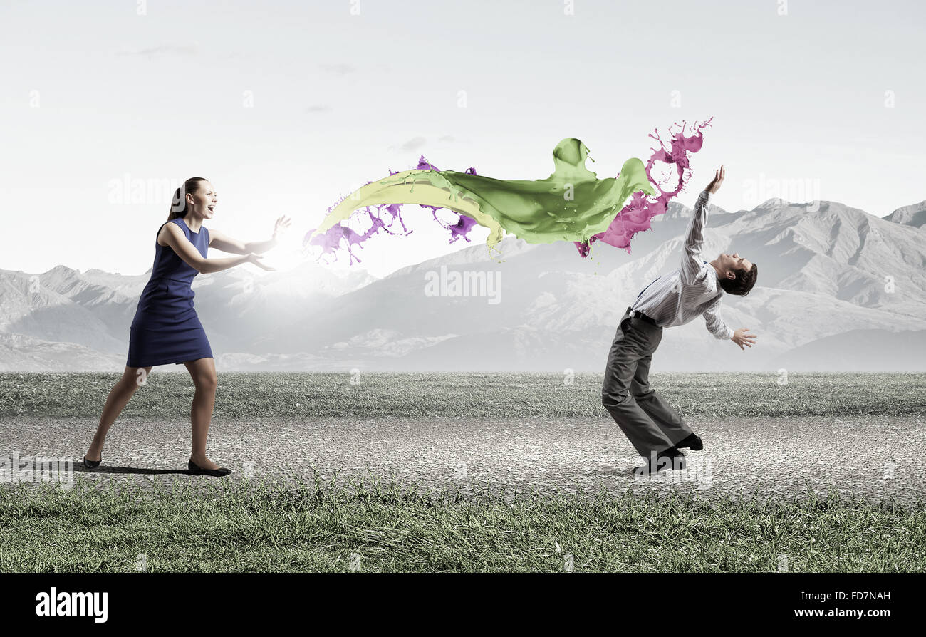 Young businessman trying to evade from thrown splashes Stock Photo - Alamy