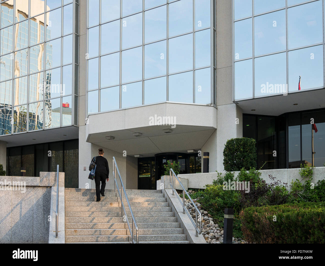 Going up the stairs to enter an office building Stock Photo - Alamy