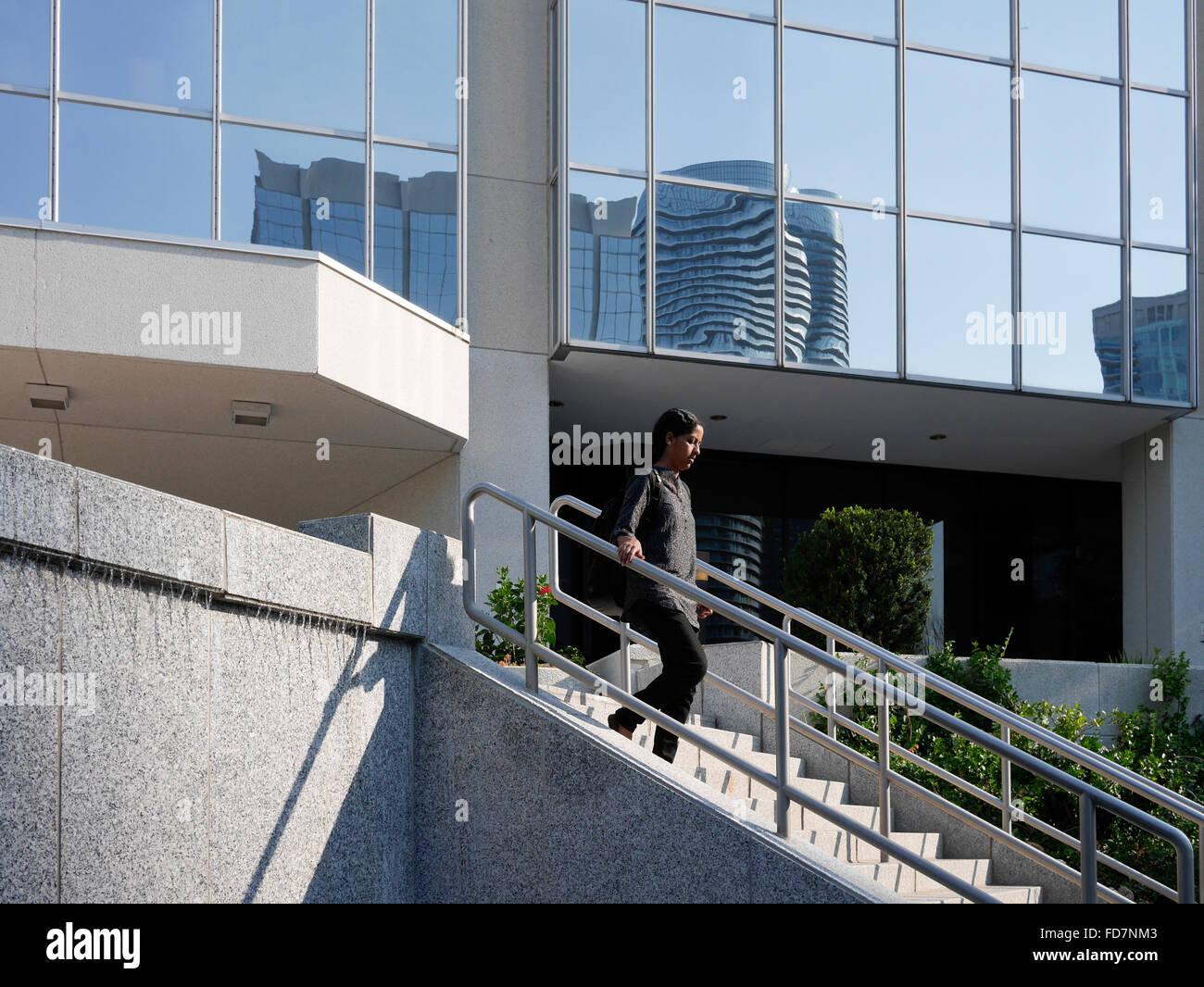 Going down the stairs leaving an office building Stock Photo - Alamy