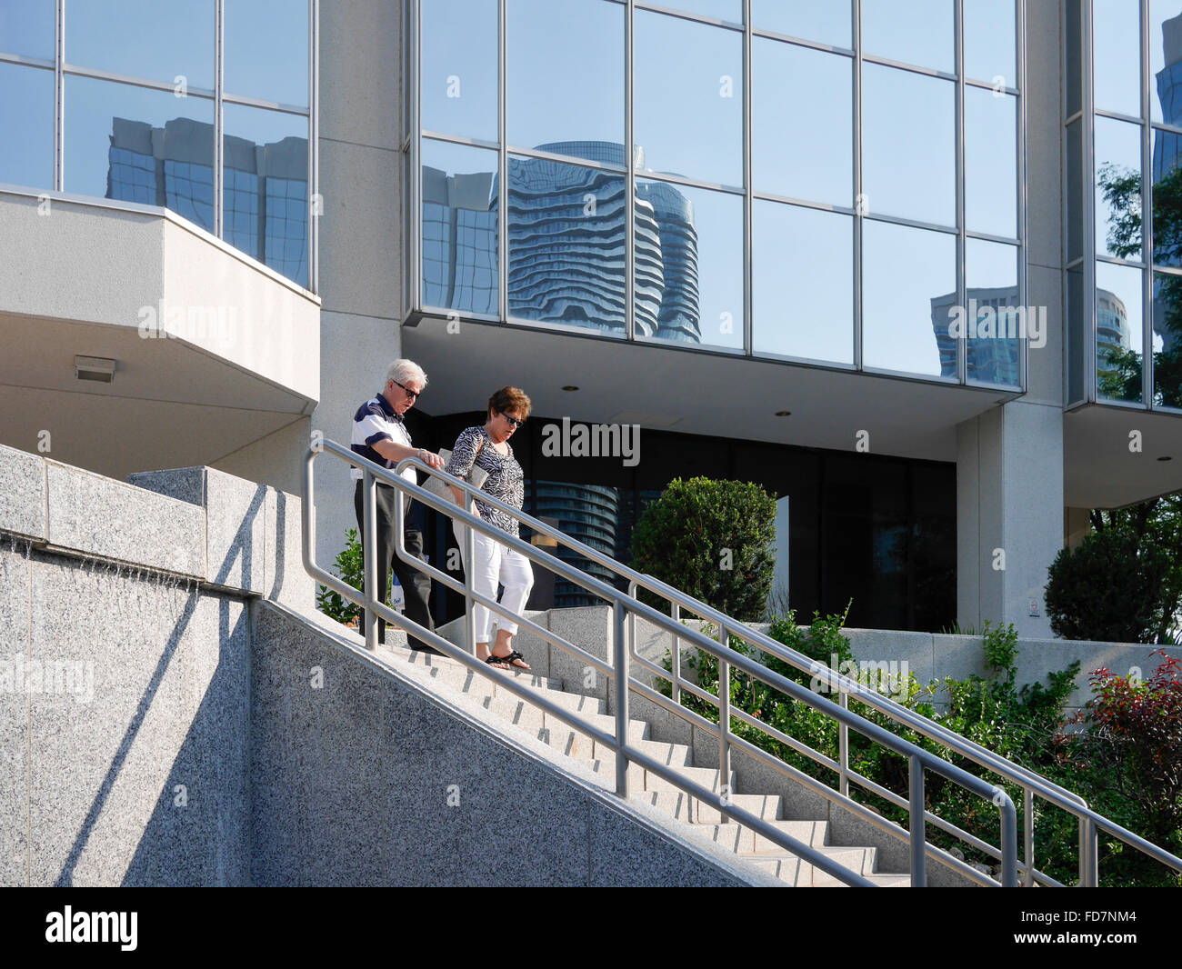 Going down the stairs leaving an office building Stock Photo - Alamy