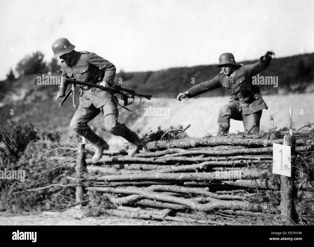 Obstacle course with machine gun, 1934 Stock Photo - Alamy