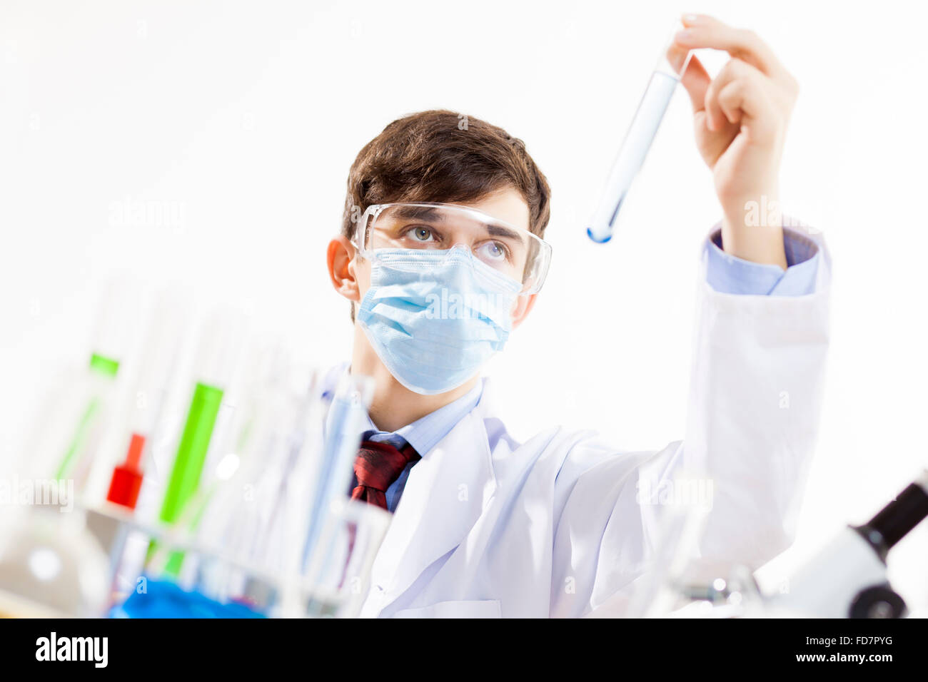 Young scientist making chemical tests in laboratory hi-res stock ...