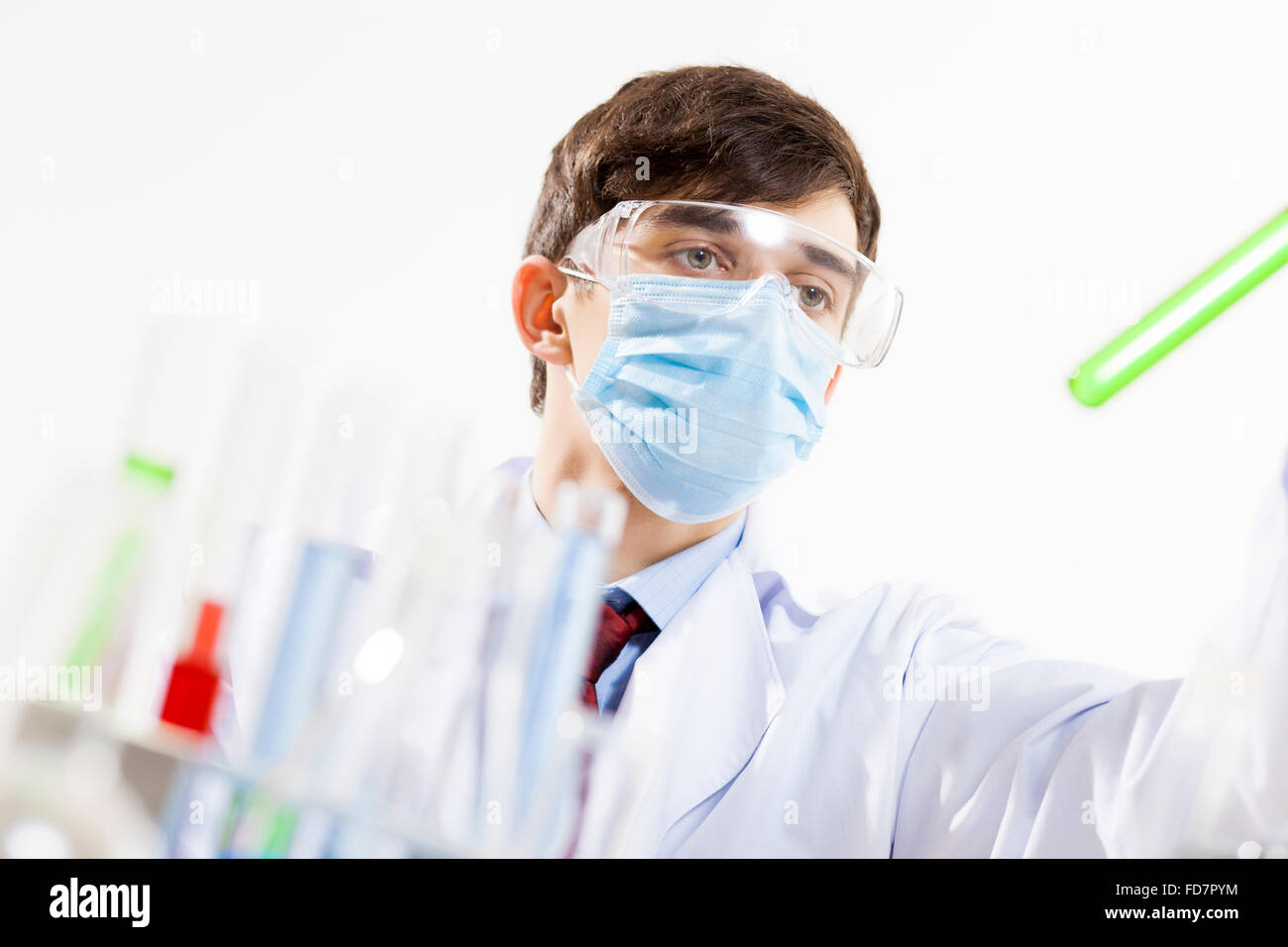 Young scientist making chemical tests in laboratory hi-res stock ...