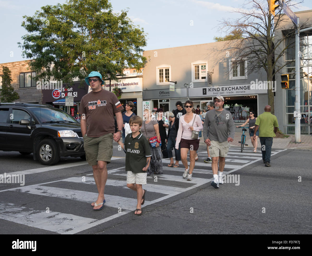 Pedestrians at a suburban crosswalk on a summer evening Stock Photo - Alamy