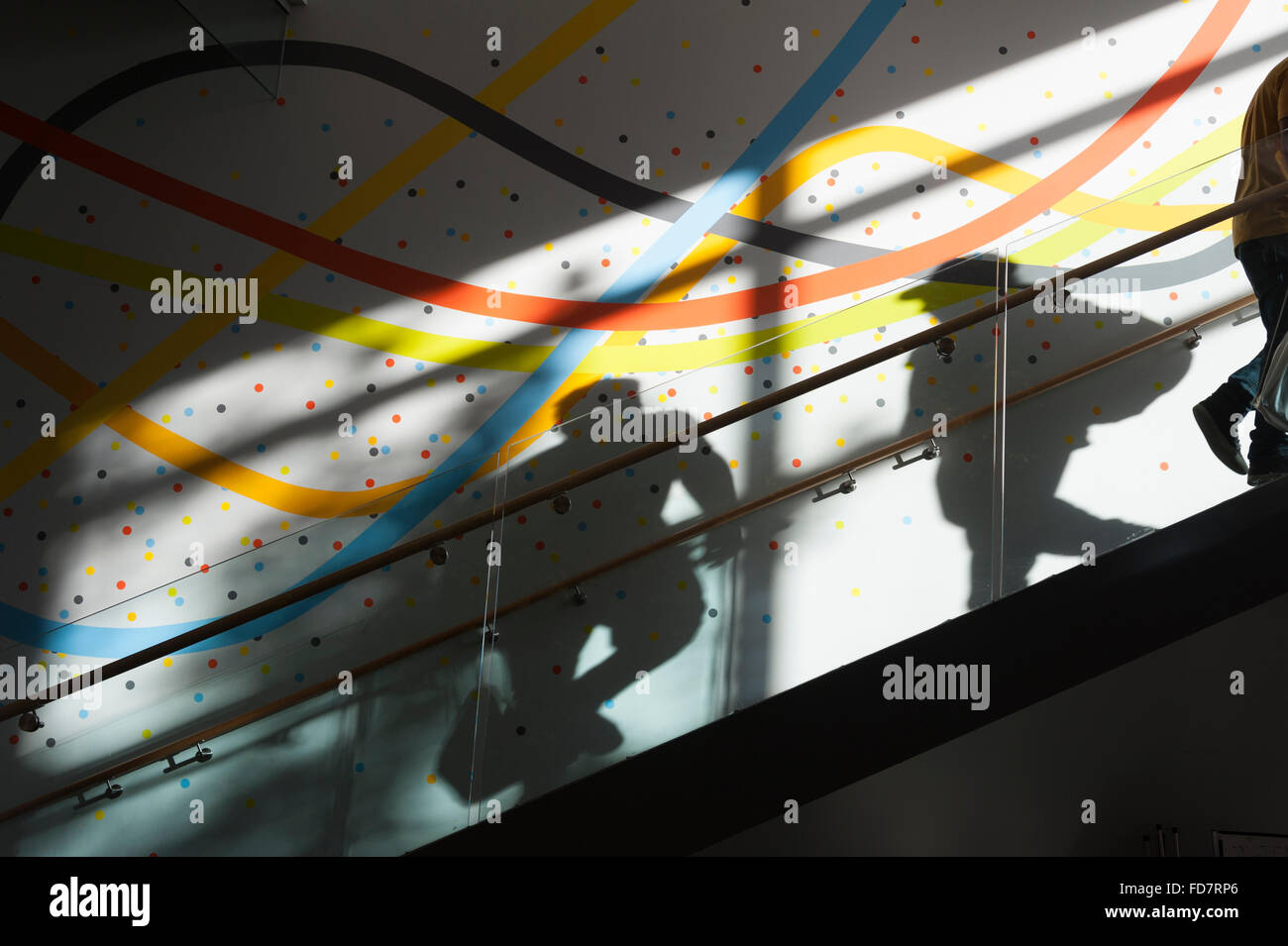 Shadow of people walking down stairs Stock Photo - Alamy