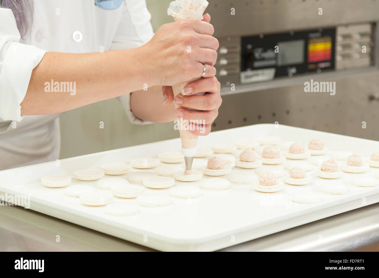 A baker making French Macaroon in a bakery Stock Photo - Alamy