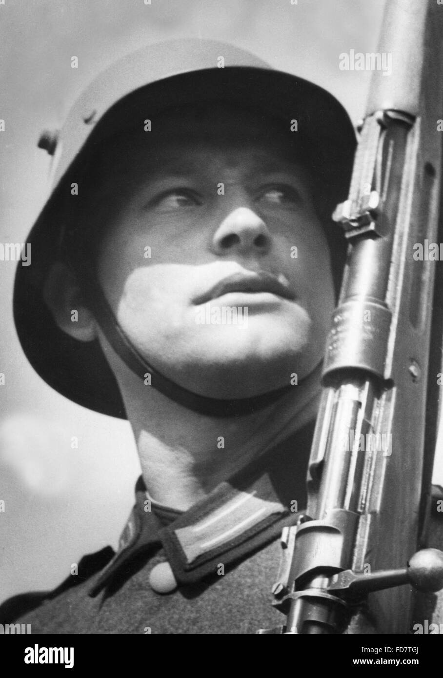Soldier carries Black and White Stock Photos & Images - Alamy