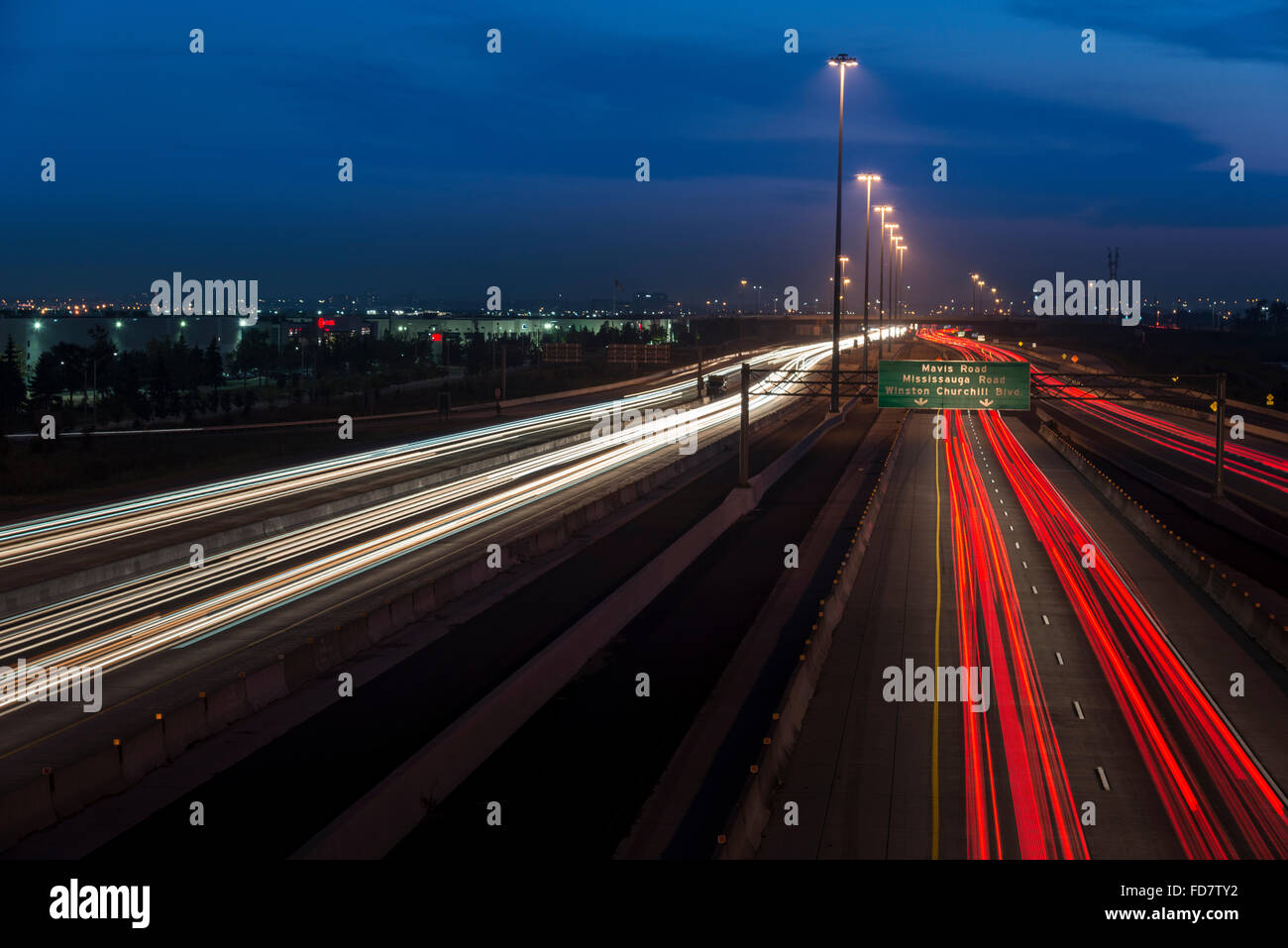 White & red light trails of traffic on highway Stock Photo - Alamy