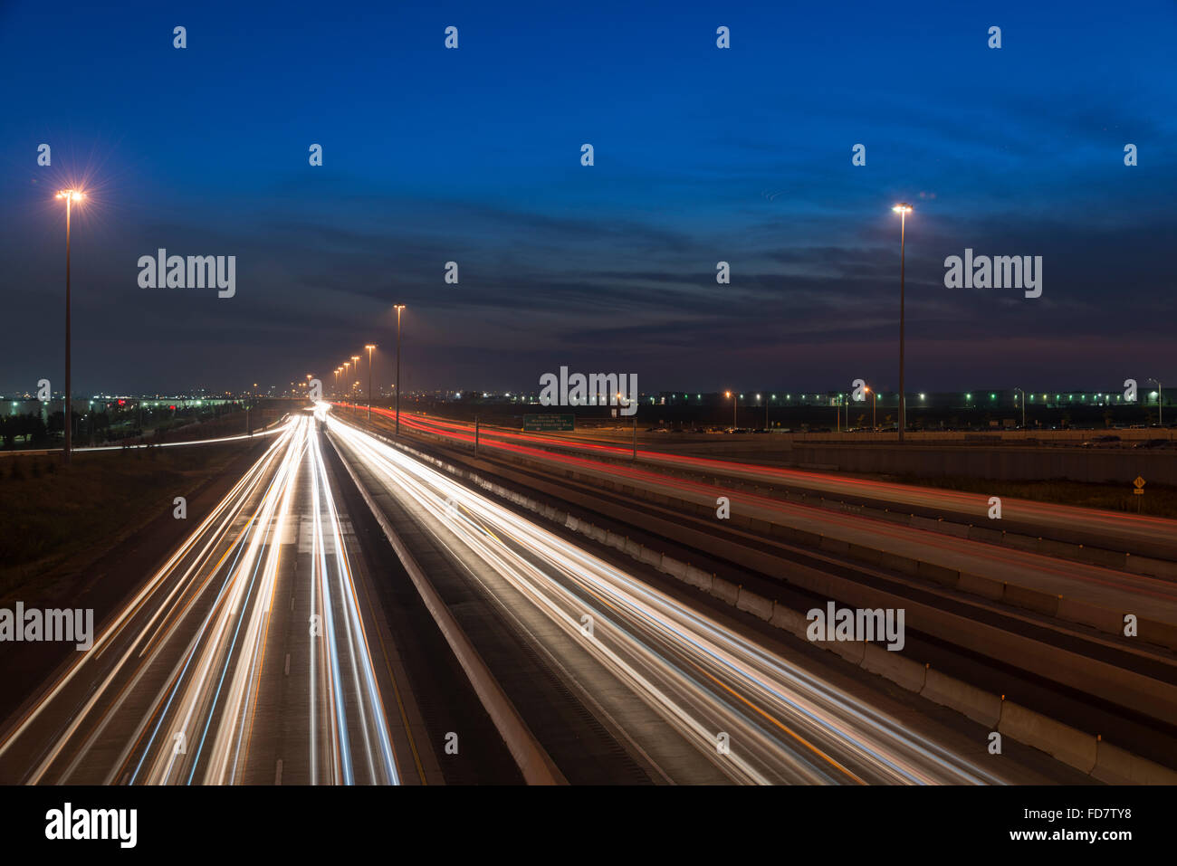 White & red light trails of traffic on highway Stock Photo - Alamy