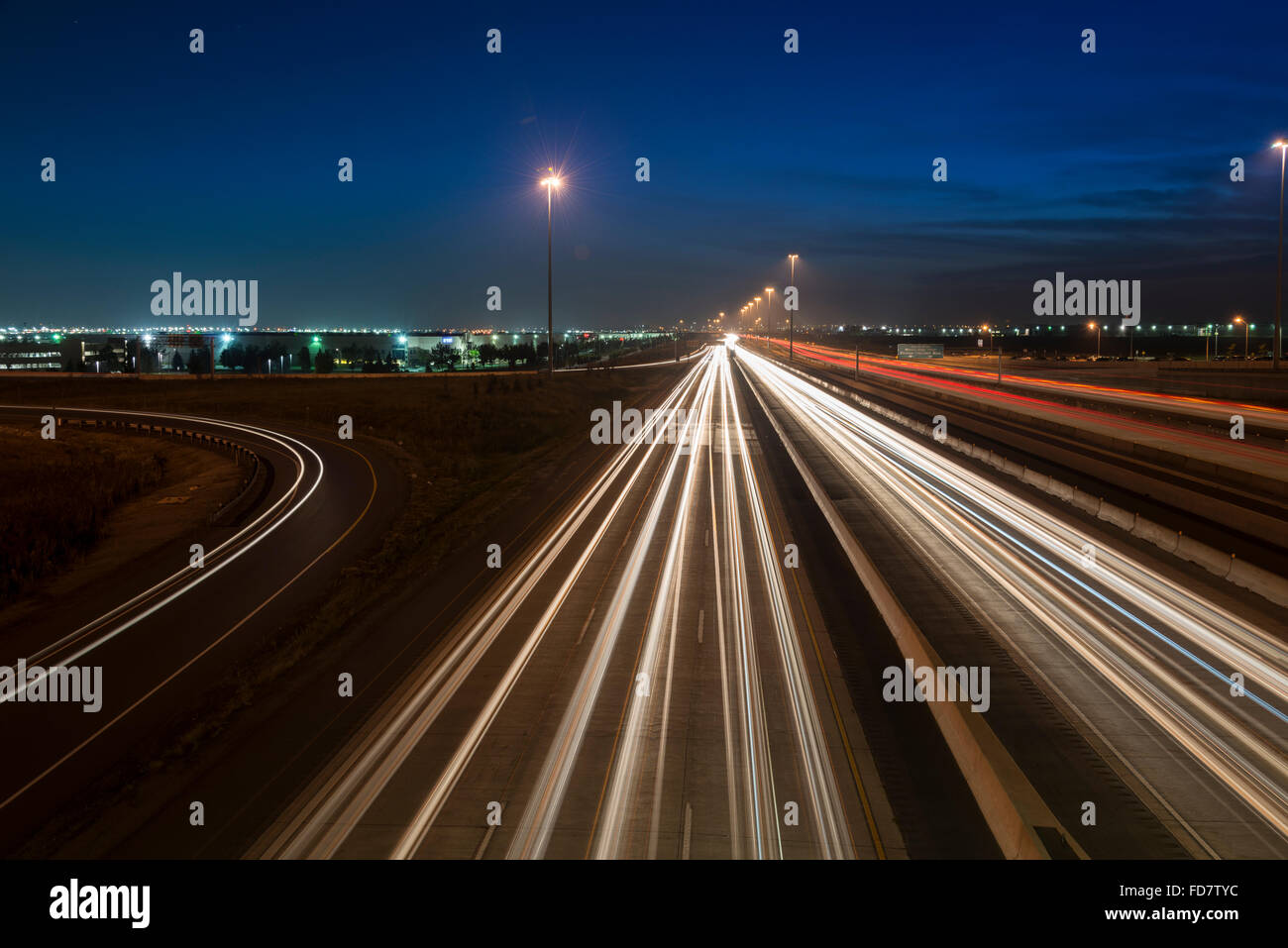 White & red light trails of traffic on highway Stock Photo - Alamy