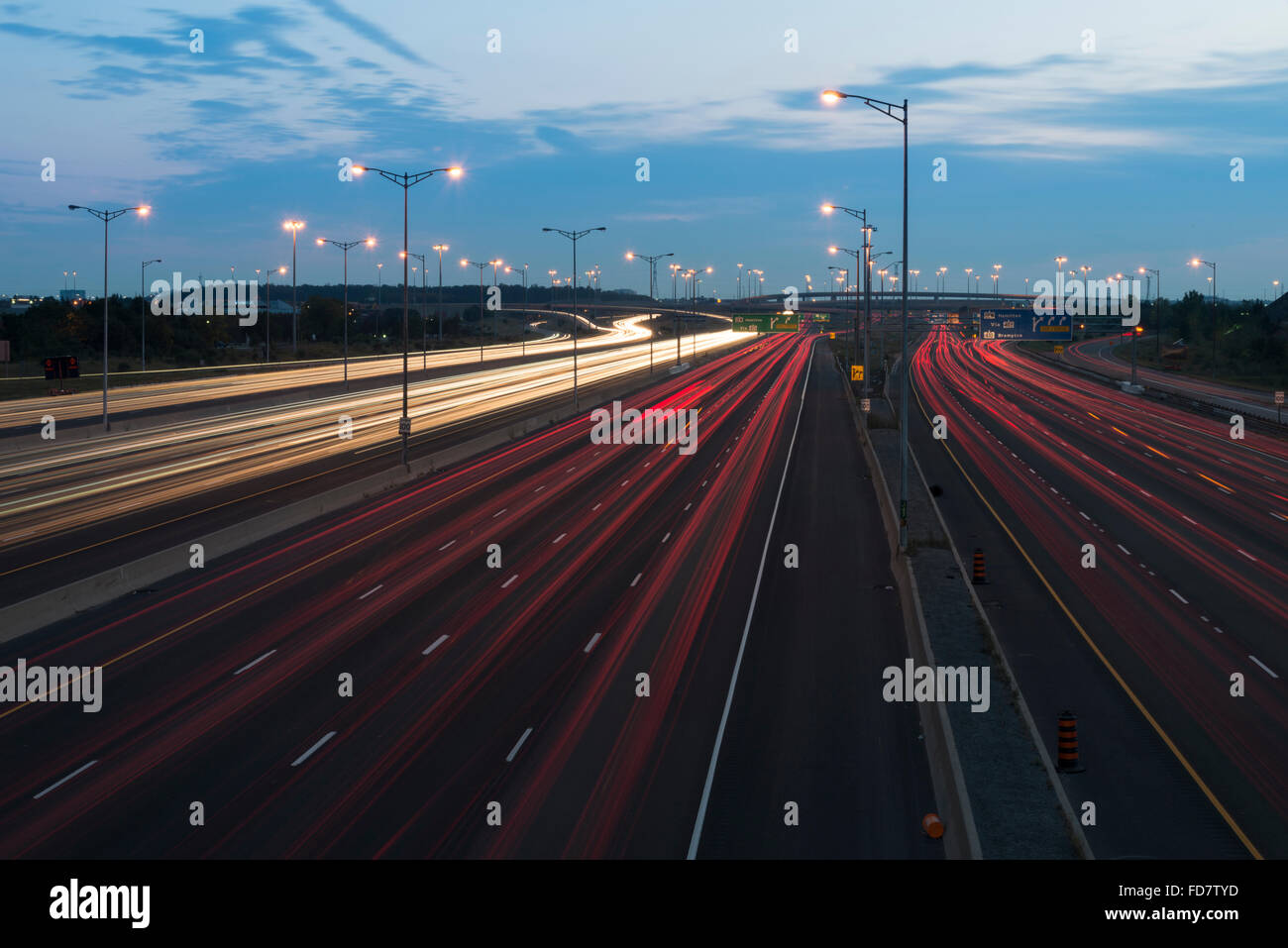 White & red light trails of traffic on highway Stock Photo - Alamy