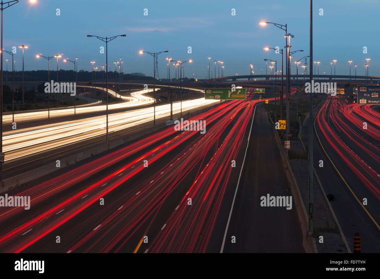 White & red light trails of traffic on highway Stock Photo - Alamy