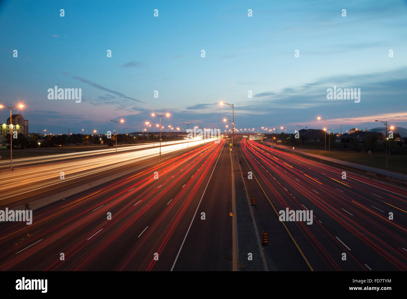 White & red light trails of traffic on highway Stock Photo - Alamy