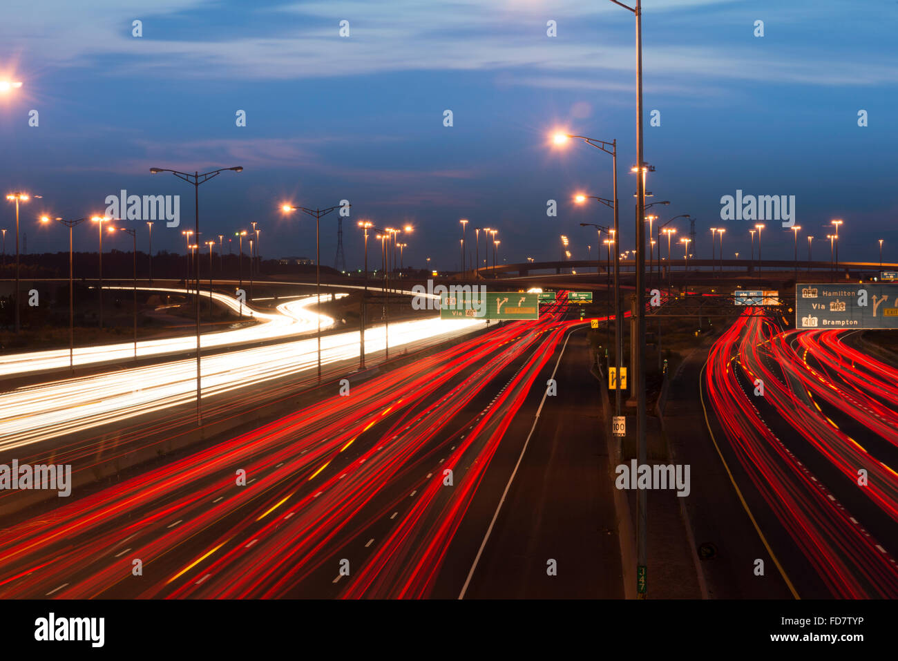 White & red light trails of traffic on highway Stock Photo - Alamy