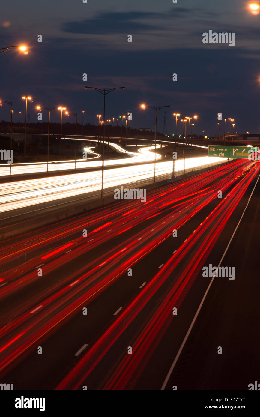White & red light trails of traffic on highway Stock Photo - Alamy