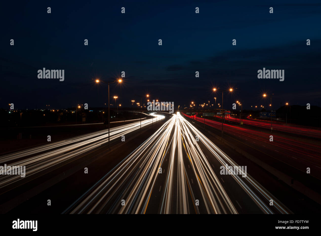 White & red light trails of traffic on highway Stock Photo - Alamy
