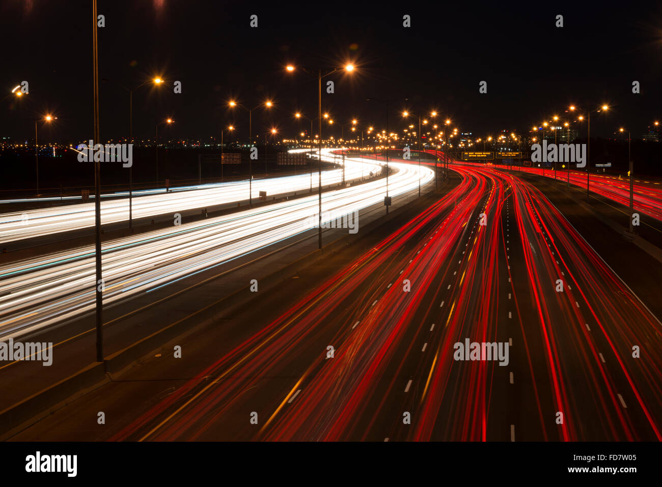 White & red light trails of traffic on highway Stock Photo - Alamy