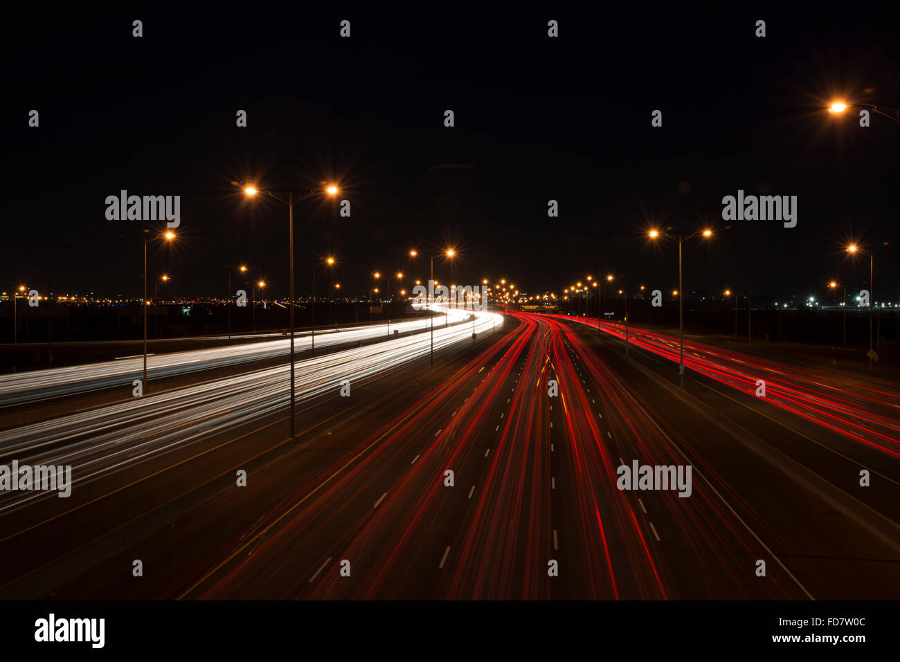 White & red light trails of traffic on highway Stock Photo - Alamy