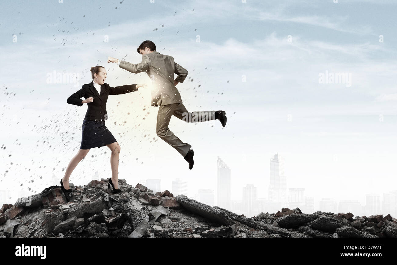 Two businesspeople in anger fighting with each other Stock Photo - Alamy