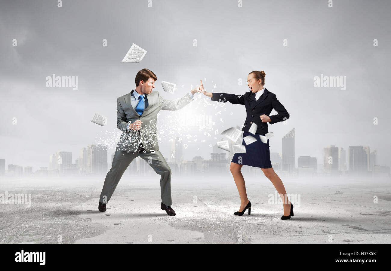 Two businesspeople in anger fighting with each other Stock Photo - Alamy