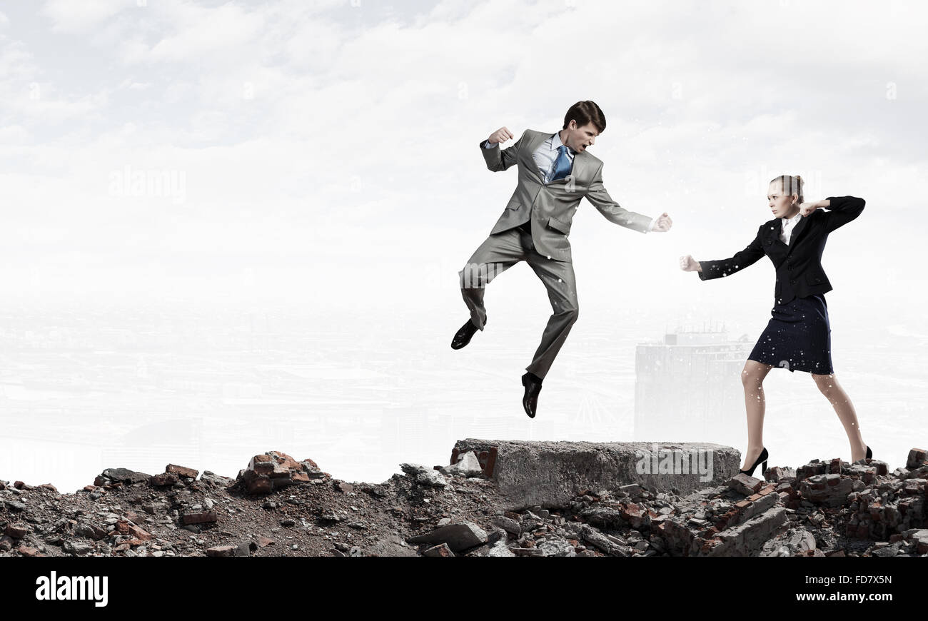 Two businesspeople in anger fighting with each other Stock Photo - Alamy