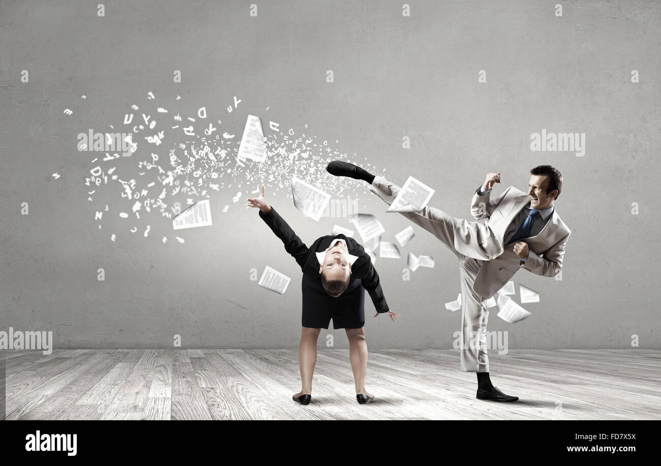 Two businesspeople in anger fighting with each other Stock Photo - Alamy