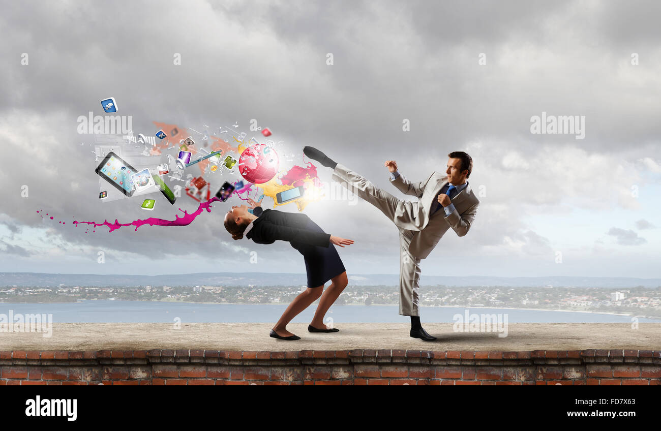 Two businesspeople in anger fighting with each other Stock Photo - Alamy
