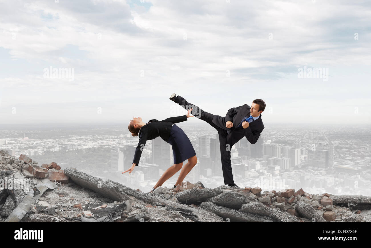 Two businesspeople in anger fighting with each other Stock Photo - Alamy
