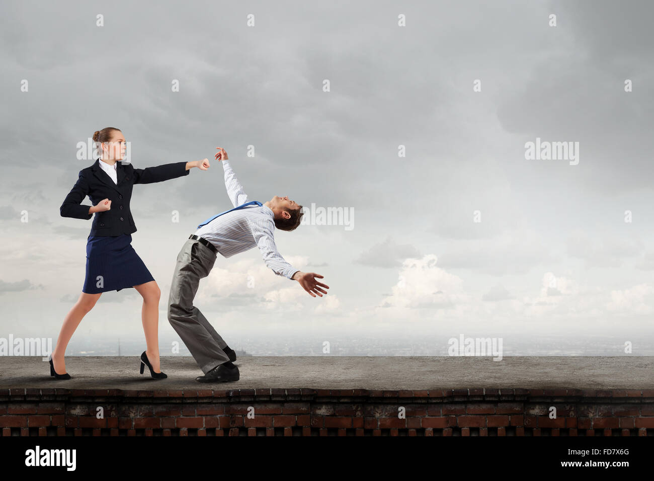 Two businesspeople in anger fighting with each other Stock Photo - Alamy
