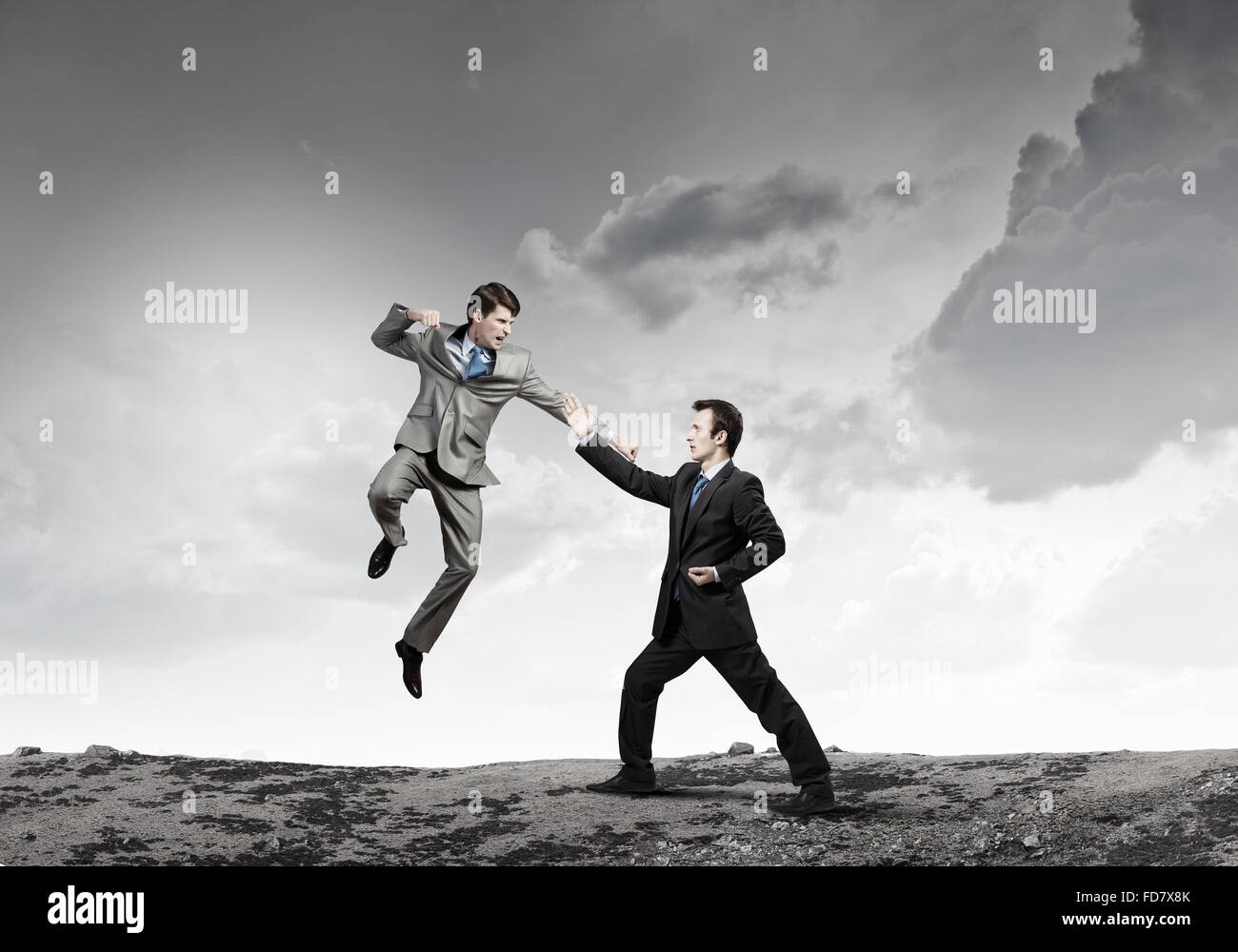 Two businesspeople in anger fighting with each other Stock Photo - Alamy