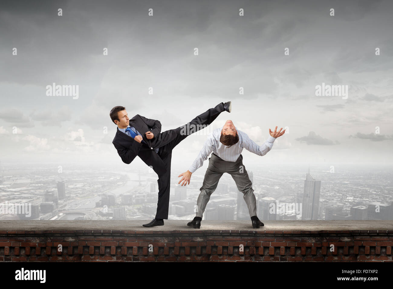 Two businesspeople in anger fighting with each other Stock Photo - Alamy