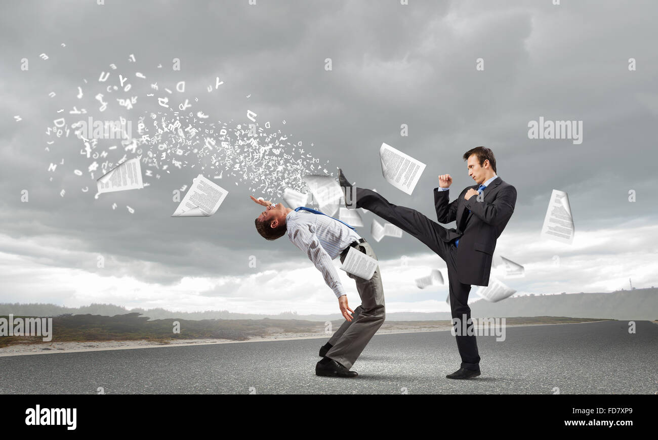 Two businesspeople in anger fighting with each other Stock Photo - Alamy