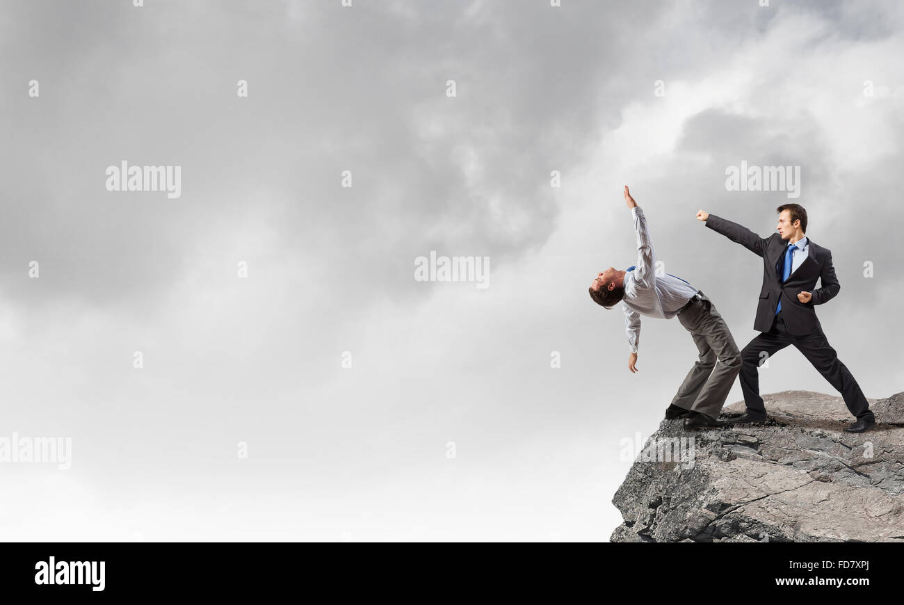 Two businesspeople in anger fighting with each other Stock Photo - Alamy