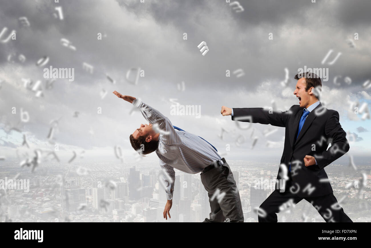 Two businesspeople in anger fighting with each other Stock Photo - Alamy