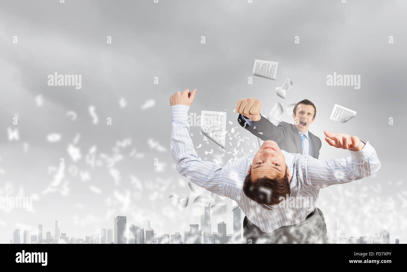 Two businesspeople in anger fighting with each other Stock Photo - Alamy