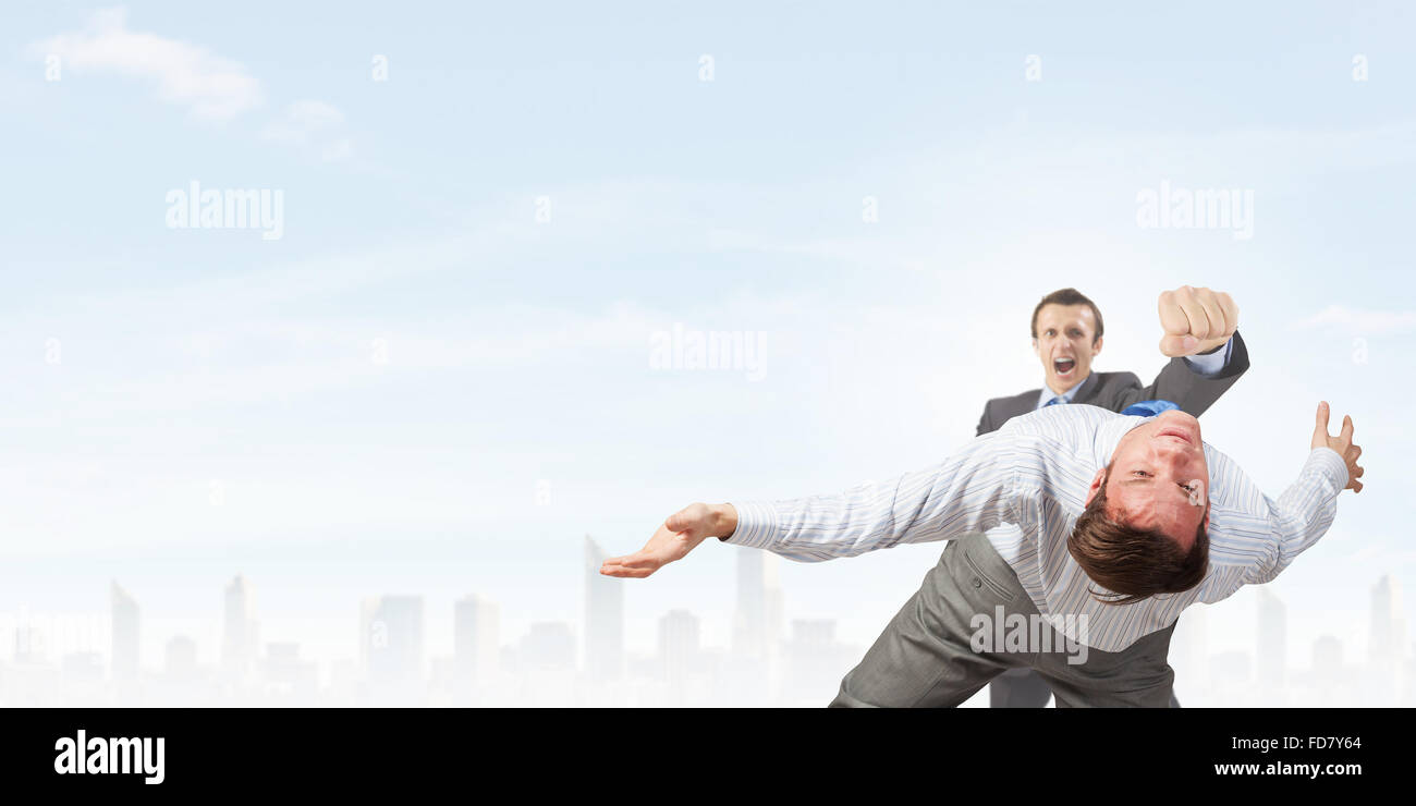 Two businesspeople in anger fighting with each other Stock Photo - Alamy