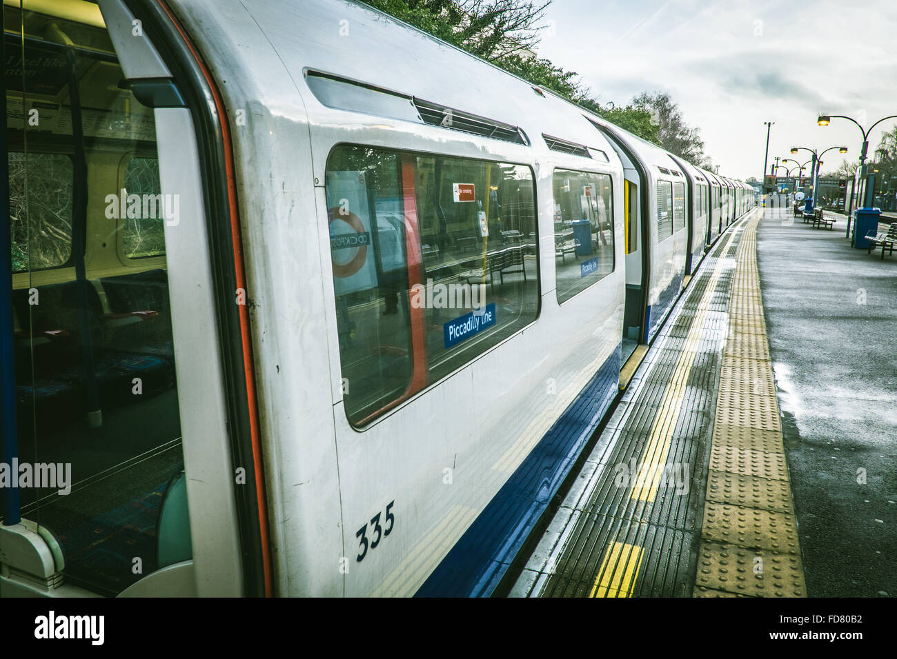 A London Underground 'tube' train stopped at a station platform Stock ...