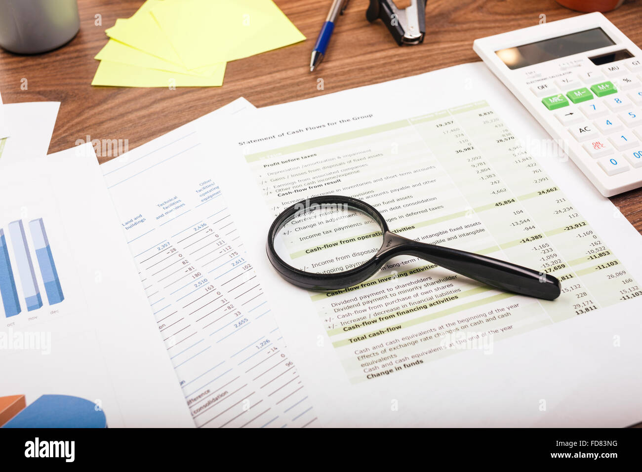 Workplace in office. Magnifying glass on the table with stationery ...