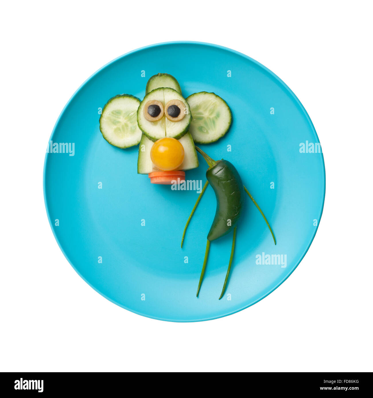 Funny monkey made of vegetables on blue plate Stock Photo - Alamy