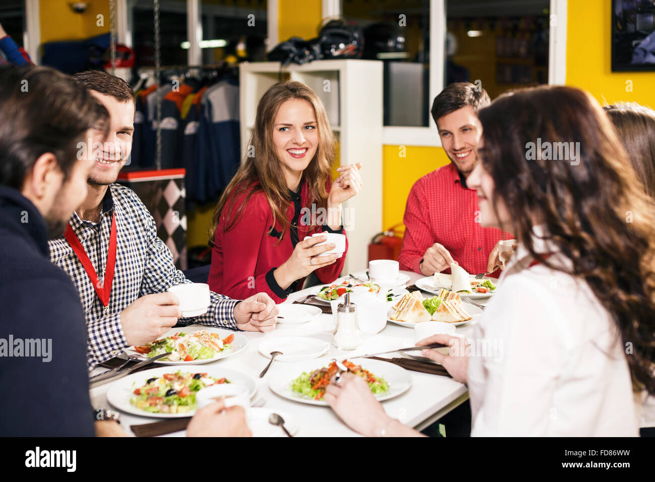 Group of people sitting at the decorated catering banquet table Stock ...