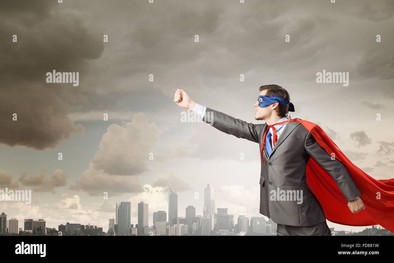 Young man in superhero costume representing power and courage Stock ...