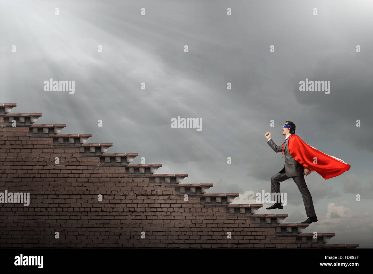 Young man in superhero costume representing power and courage Stock ...