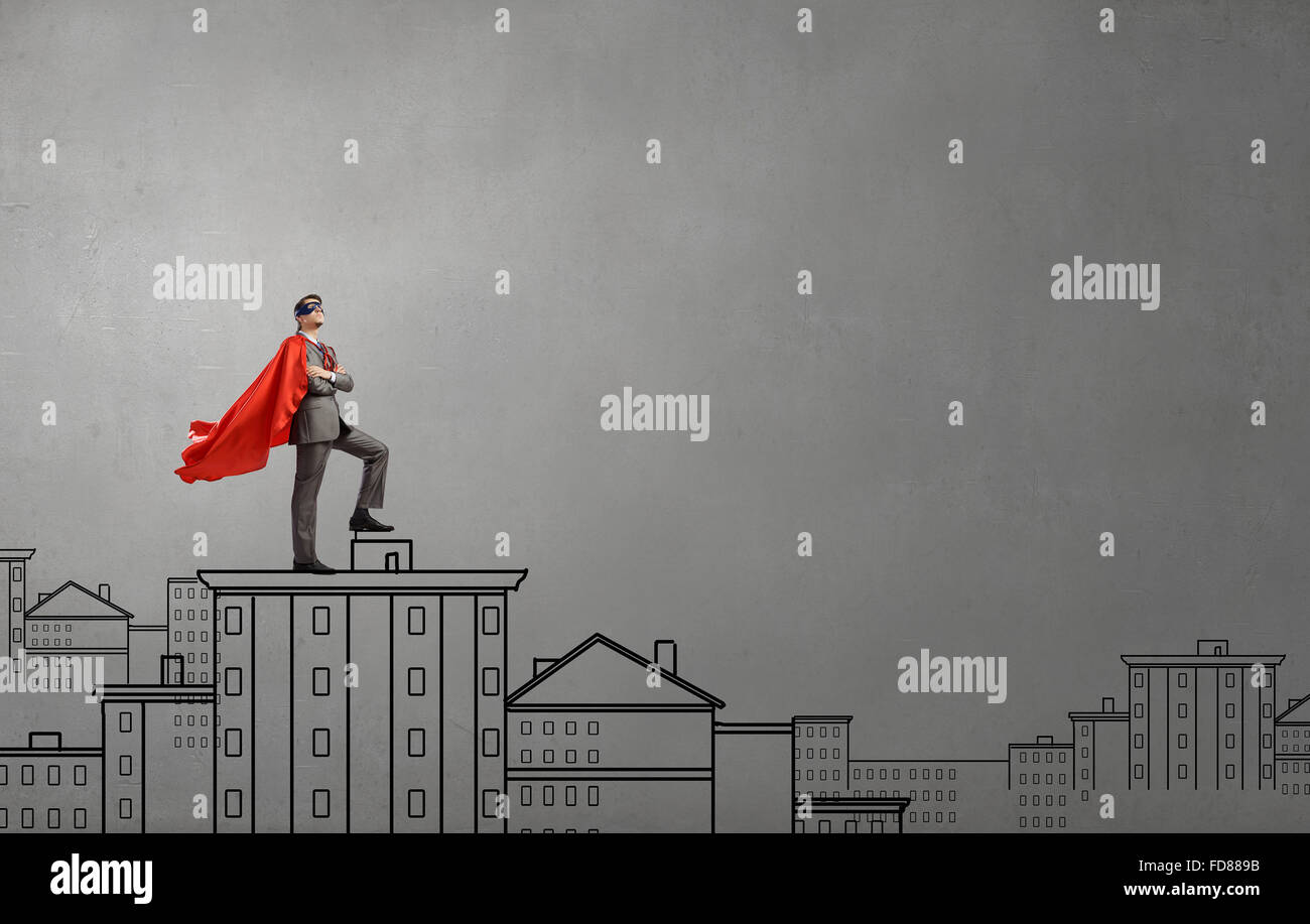Young man in superhero costume representing power and courage Stock ...