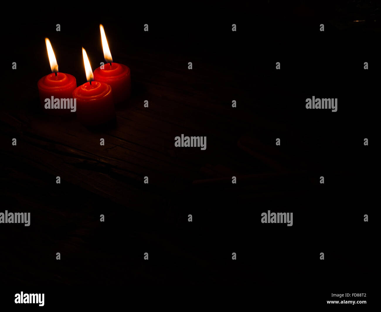 three burning candles Stock Photo - Alamy