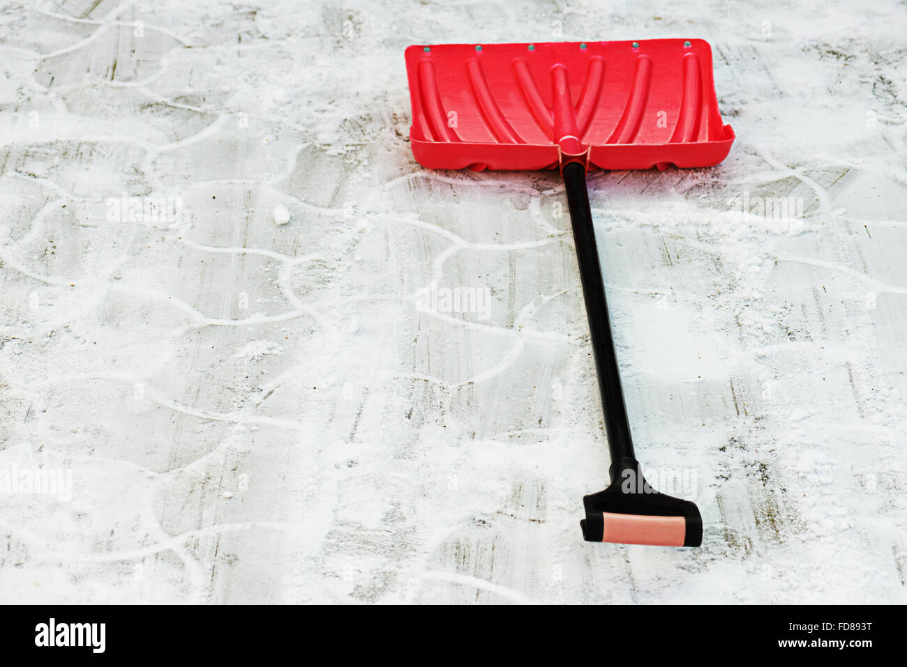 Red plastic shovel for snow removal. Winter is coming Stock Photo - Alamy