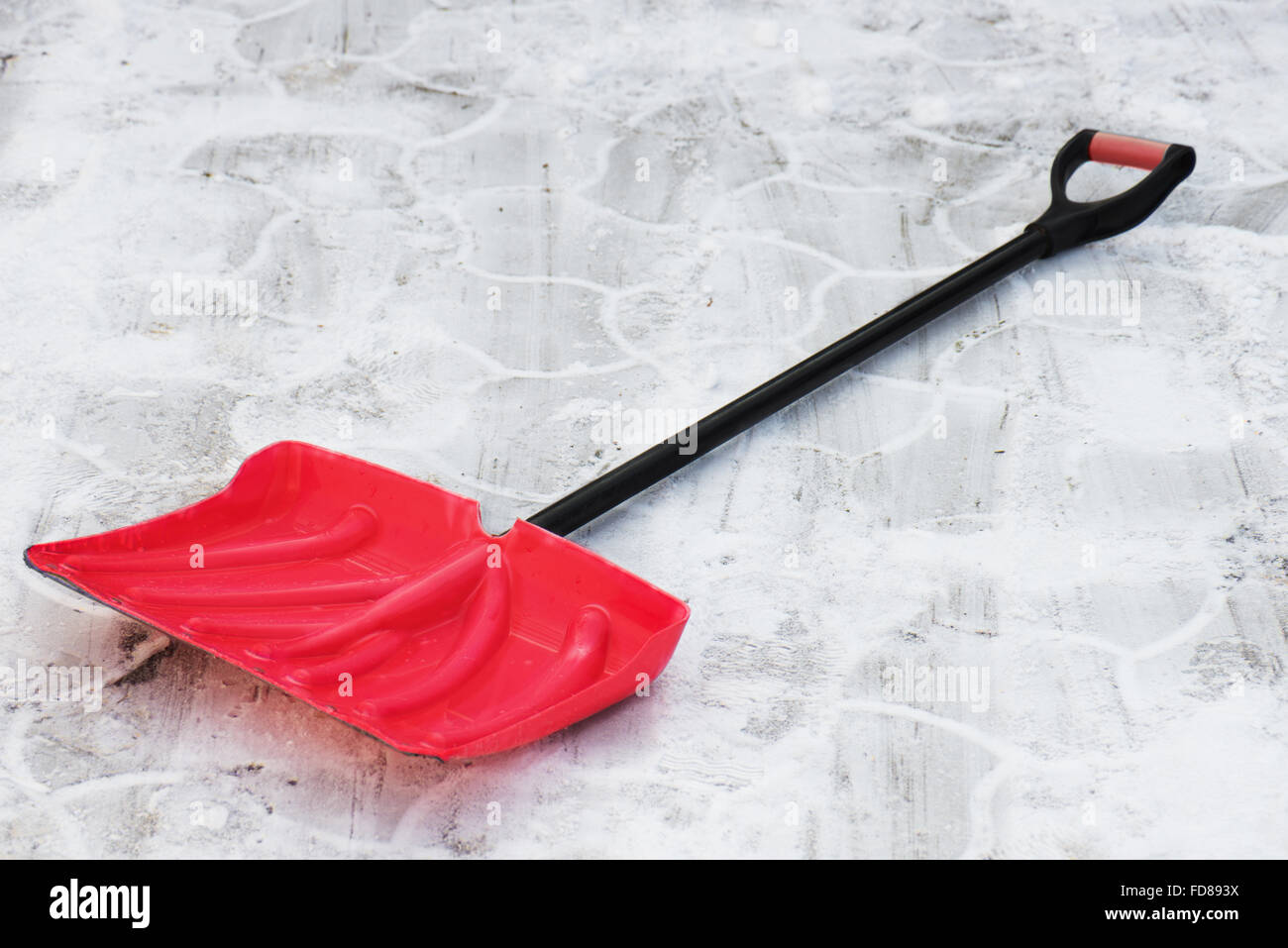 Red plastic shovel for snow removal. Winter is coming Stock Photo - Alamy